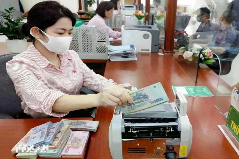 Reference exchange rate falls on January 22 | Vietnam+ (VietnamPlus)