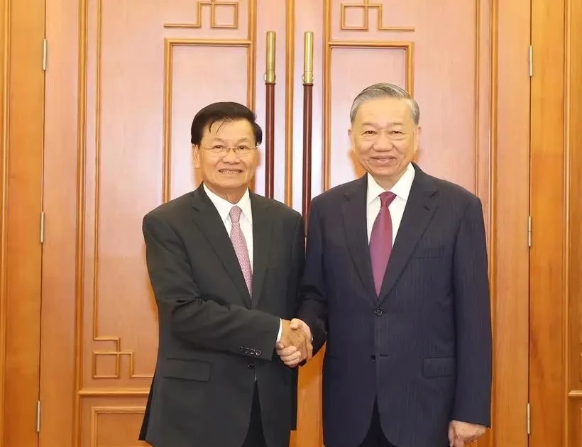 Vietnamese, Lao top leaders co-chair high-level Party meeting in Hanoi ...