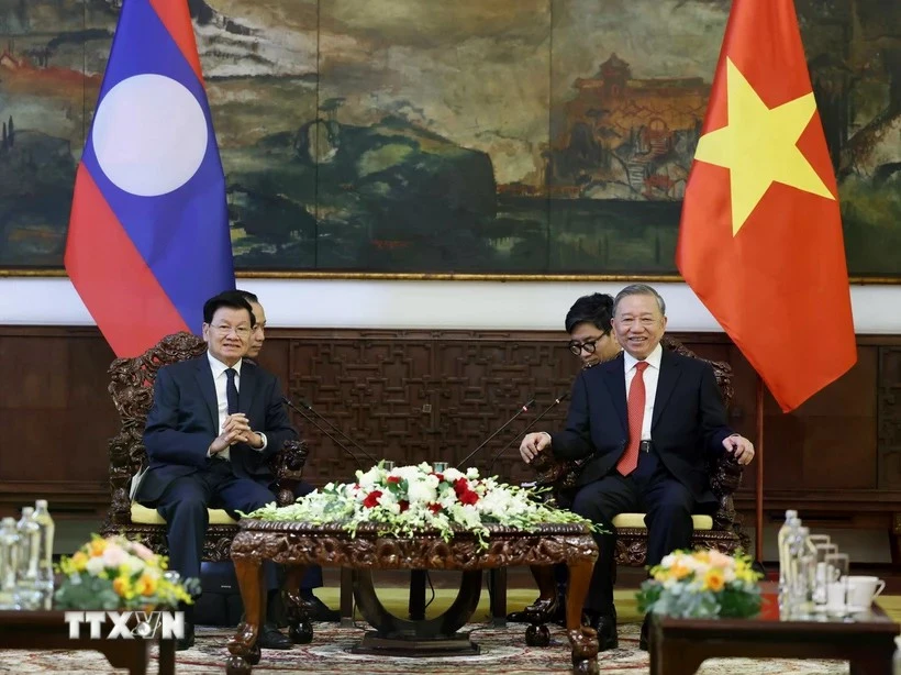 Party chief hosts top leader of Laos ahead of national reunification ...
